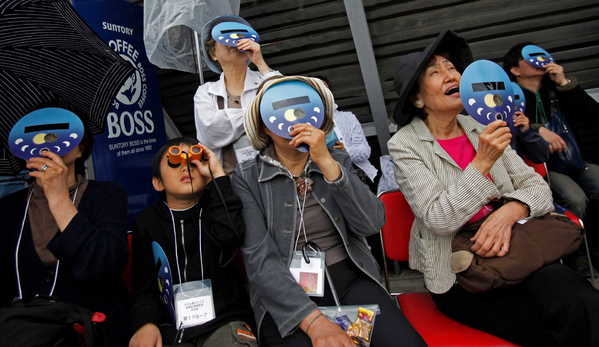 Millions look skyward as rare eclipse crosses Asia
