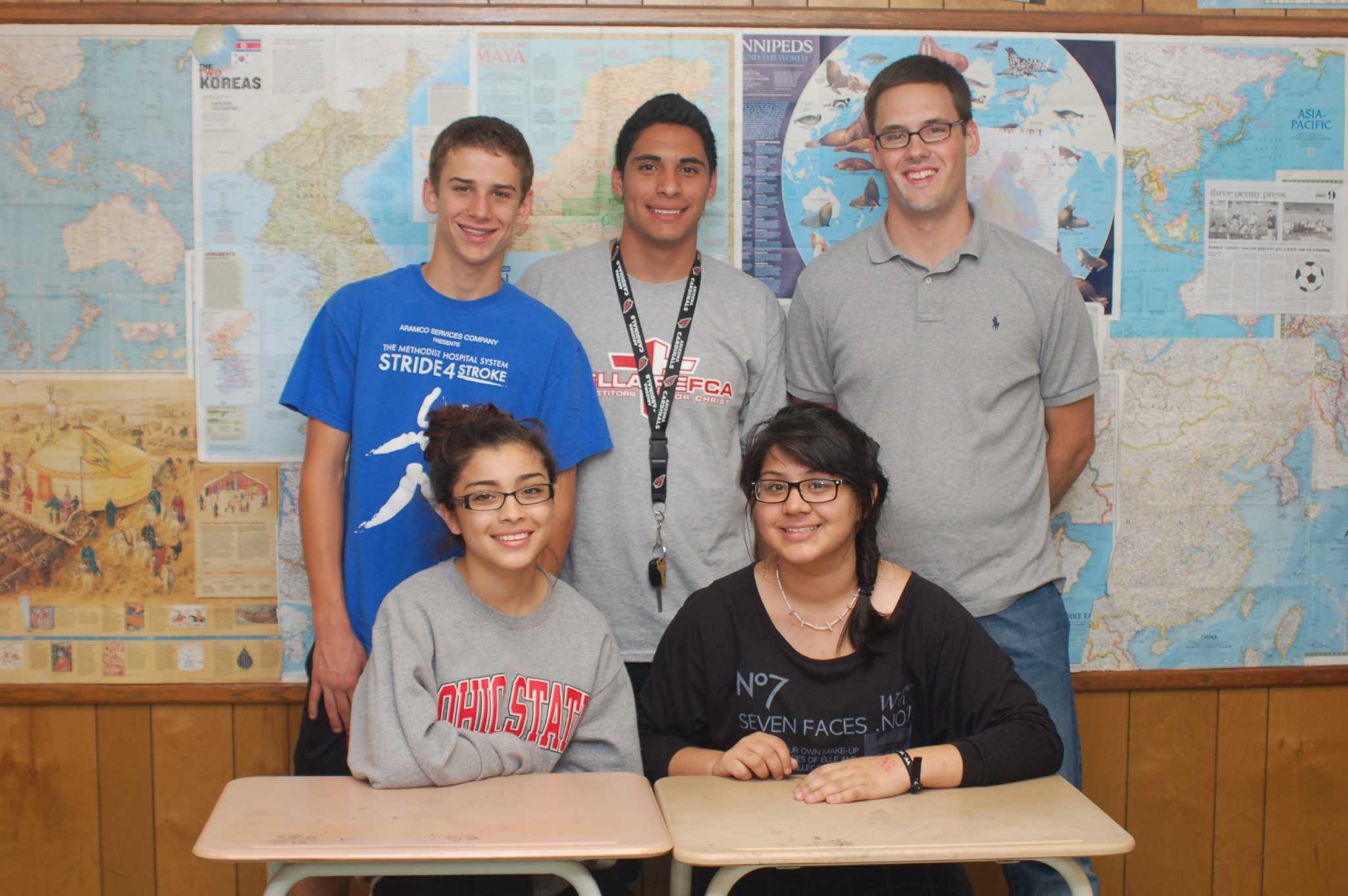 Class buying well for village