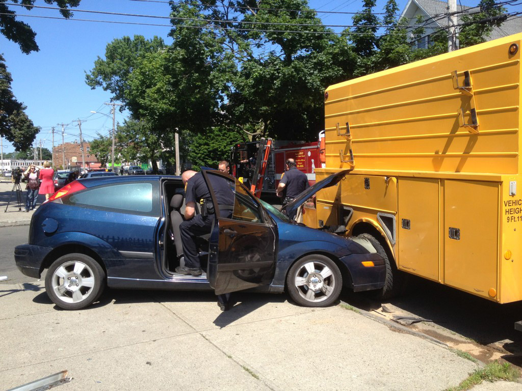 Out-of-control car hits officer's SUV, then UI truck