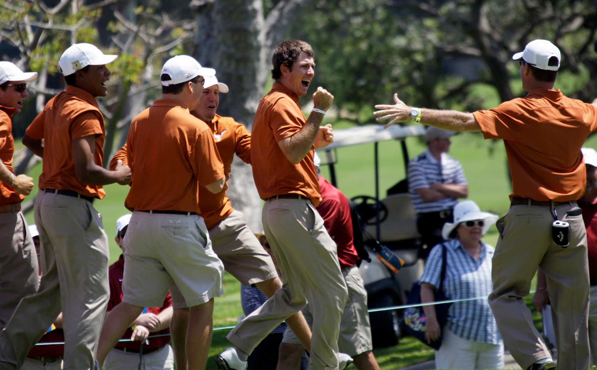 Long putt gives Longhorns third golf title