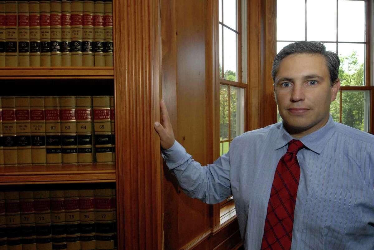 Former staffer's back pay is disputed