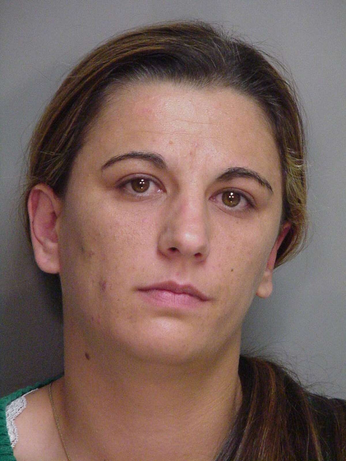 Motor vehicle clerk charged in false title cases