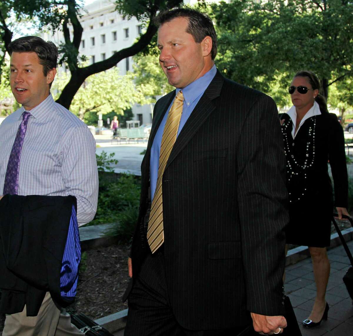 Clemens' wife says she was one who sought HGH shot