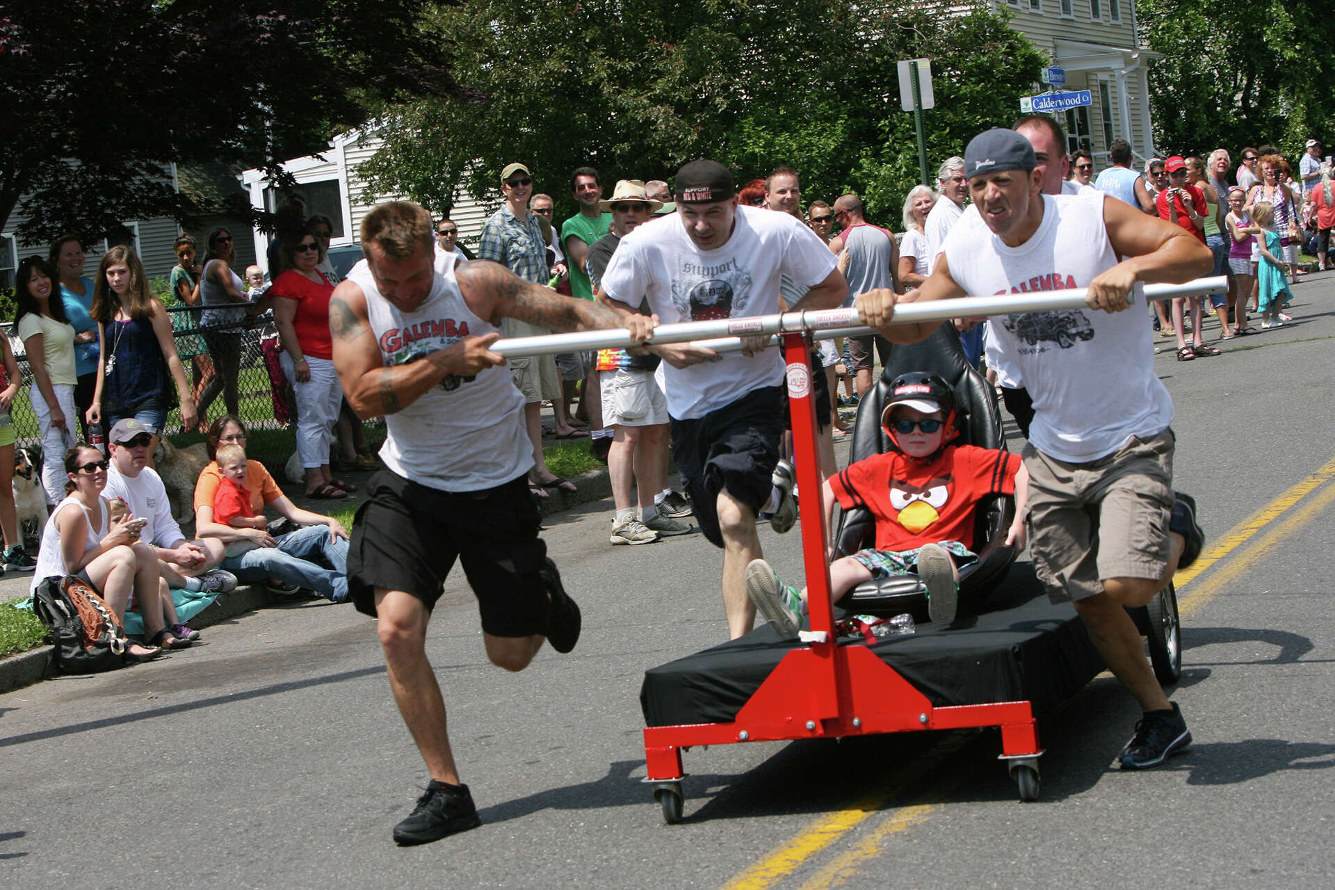 Beds race down Brewster Street at Black Rock Day celebration