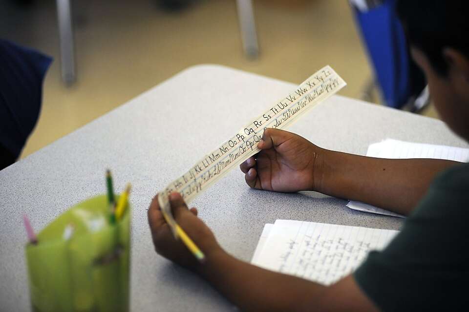 New education standards end rote learning, cursive