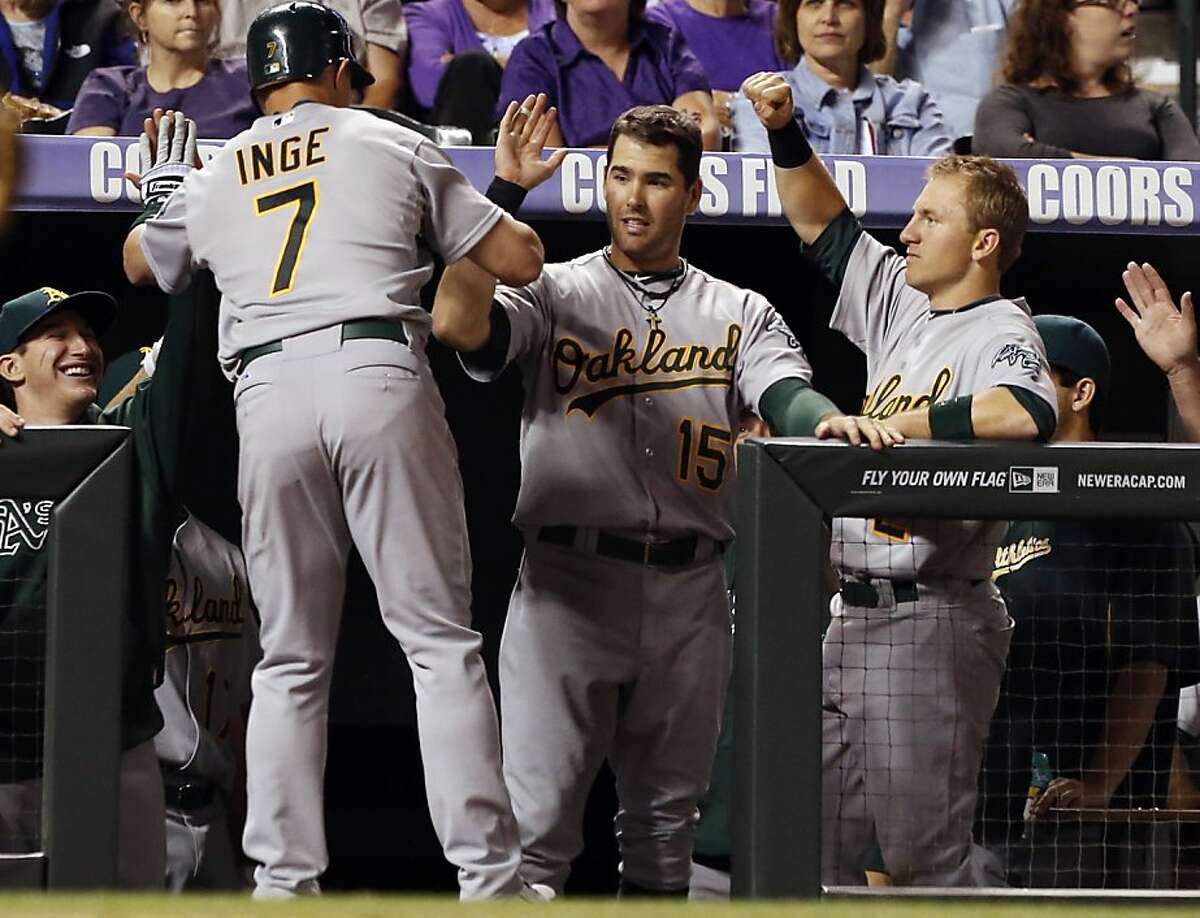 A's flex muscles, hit 4 homers in 8-5 win in Denver