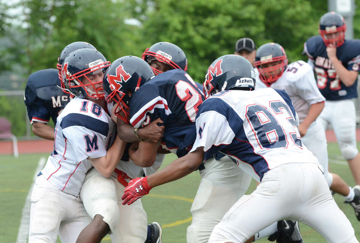 McMahon football leaning on its seniors in spring workouts