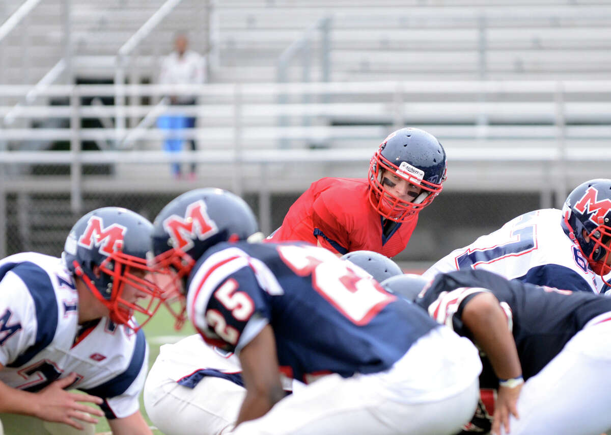 McMahon football leaning on its seniors in spring workouts