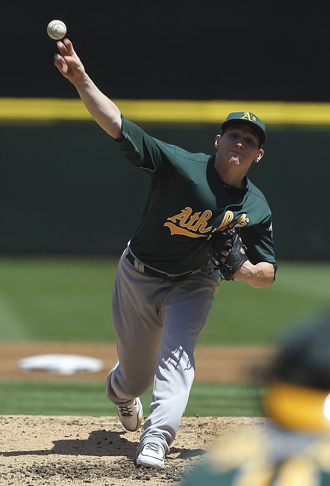 Jarrod Parker pitches A's past Mariners, 2-1