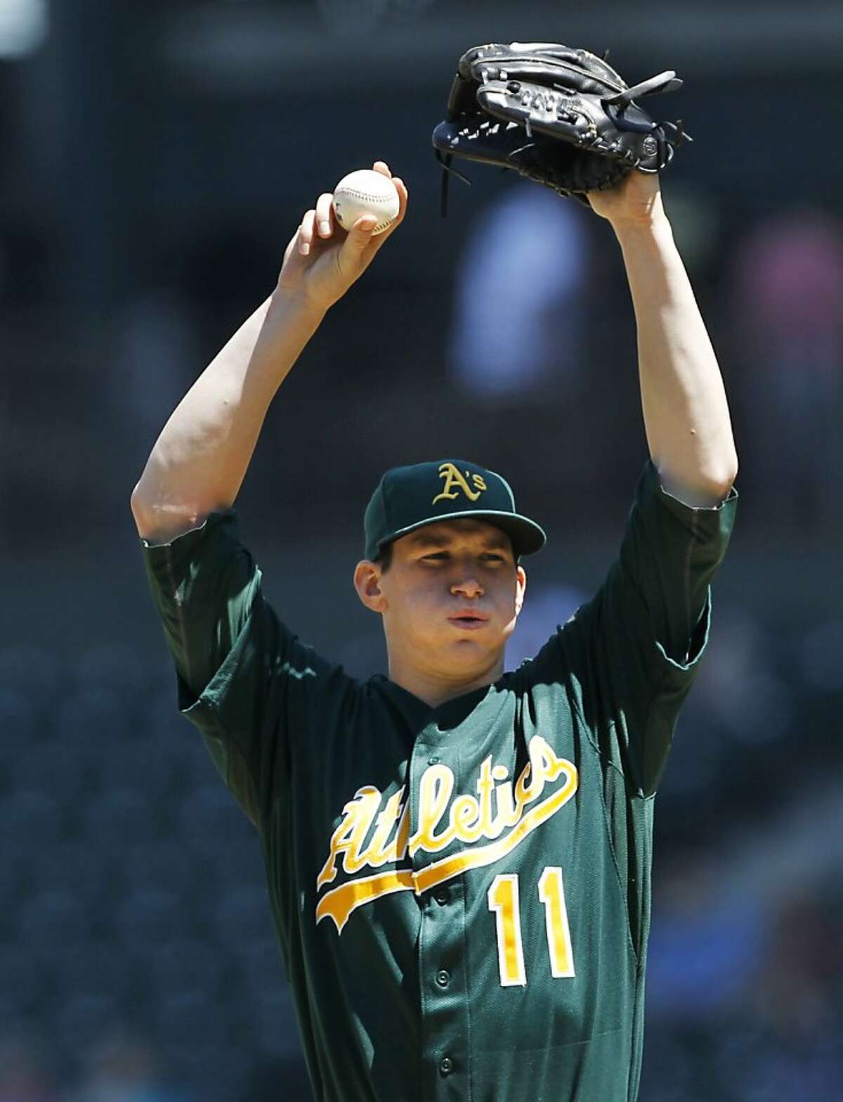 Jarrod Parker pitches A's past Mariners, 2-1