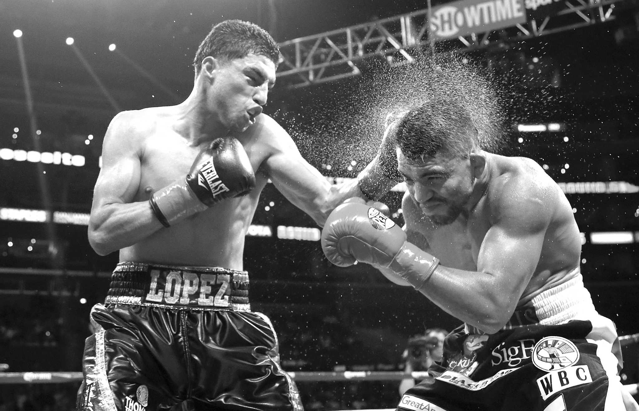 Boxer Lopez earns stripes with upset of Ortiz