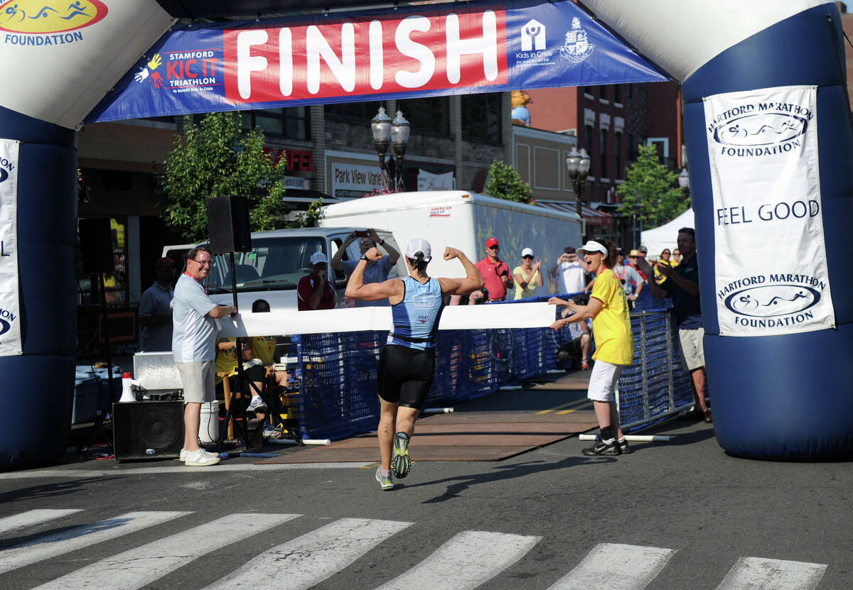 Triathletes grind it out for kids' shelter