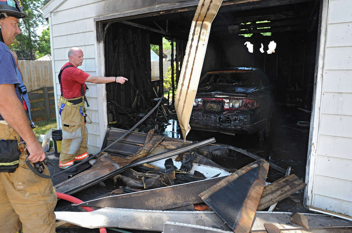 Coals linked to car, garage fire