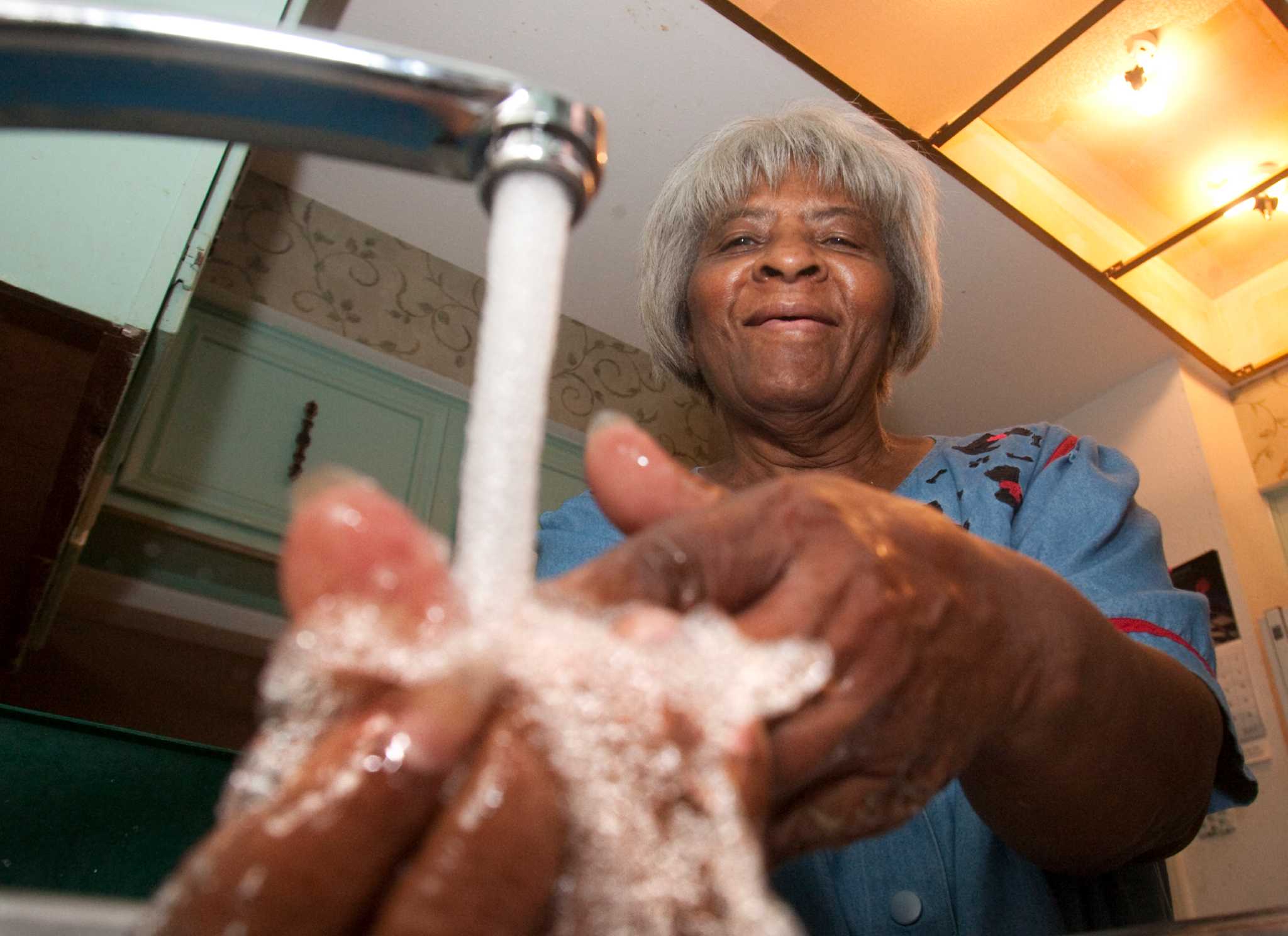 After 10 months with dry taps, water back on at woman's home
