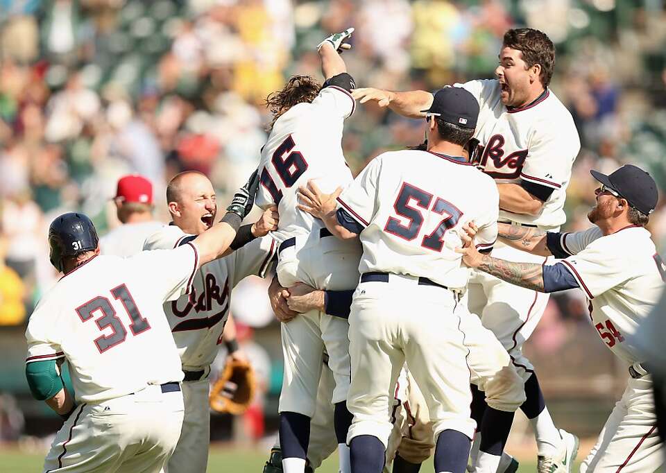A's top Mariners 2-1 to head into break at .500