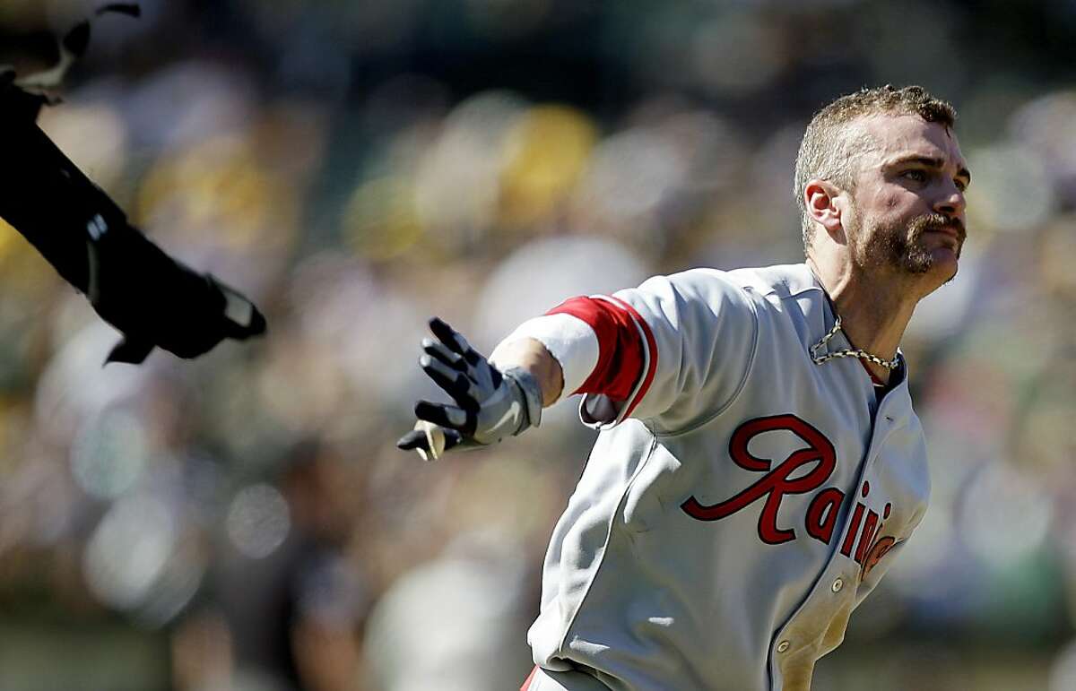 A's top Mariners 2-1 to head into break at .500