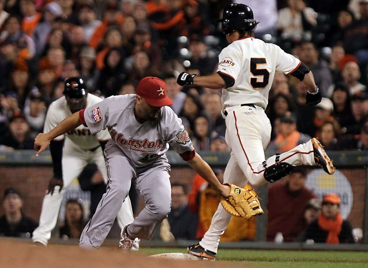 Giants in 1st after wild win in 12th