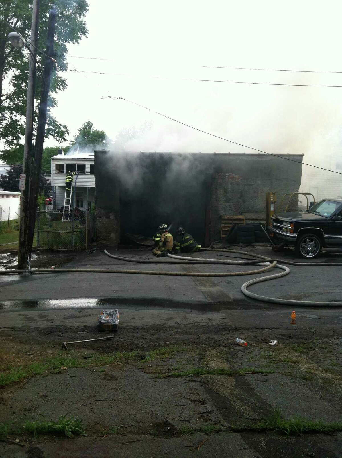 Auto repair shop fire spreads