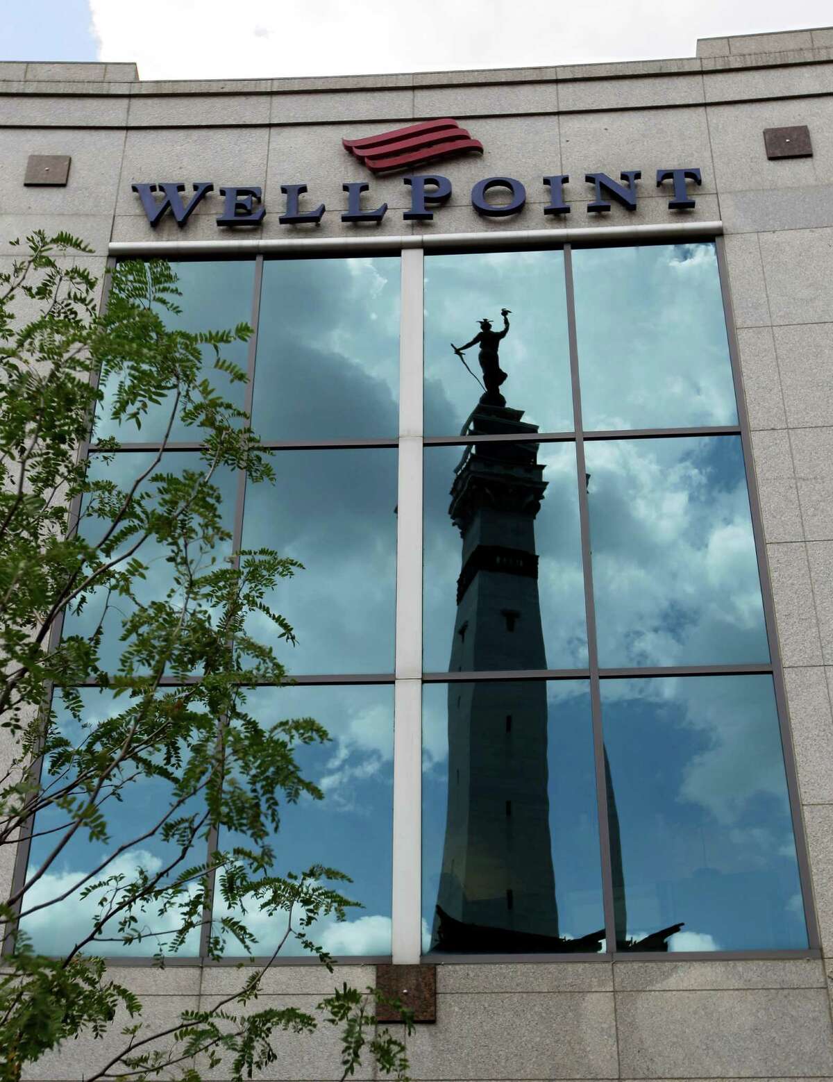 WellPoint lowers forecast after loss