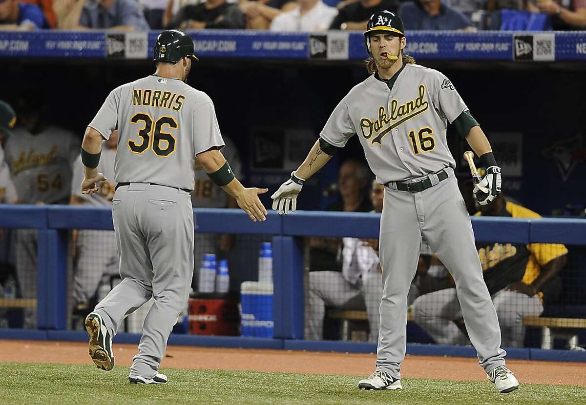 'Spiderman' Reddick helps A's toast Jays