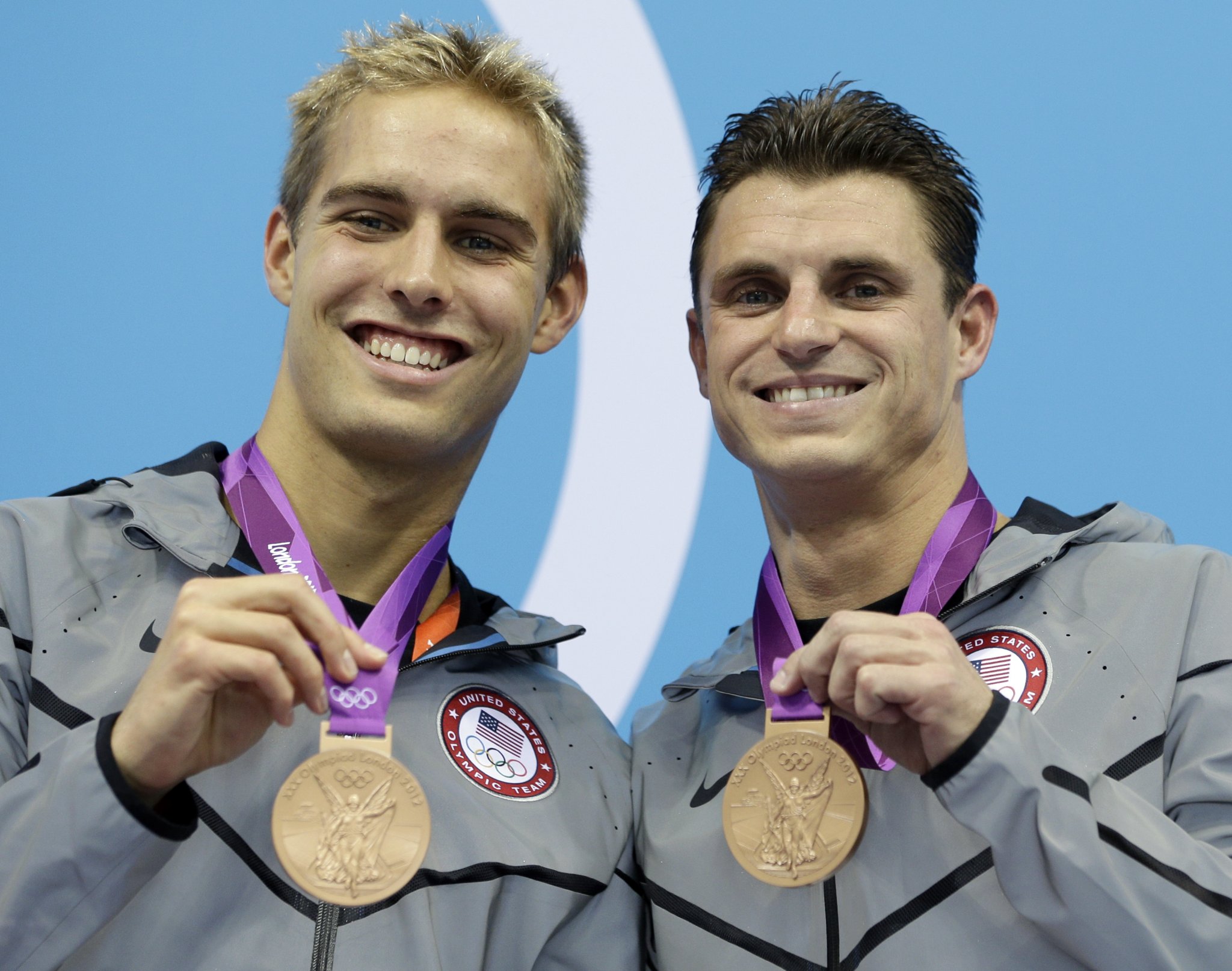 Olympics roundup: Dumais dives way to first medal