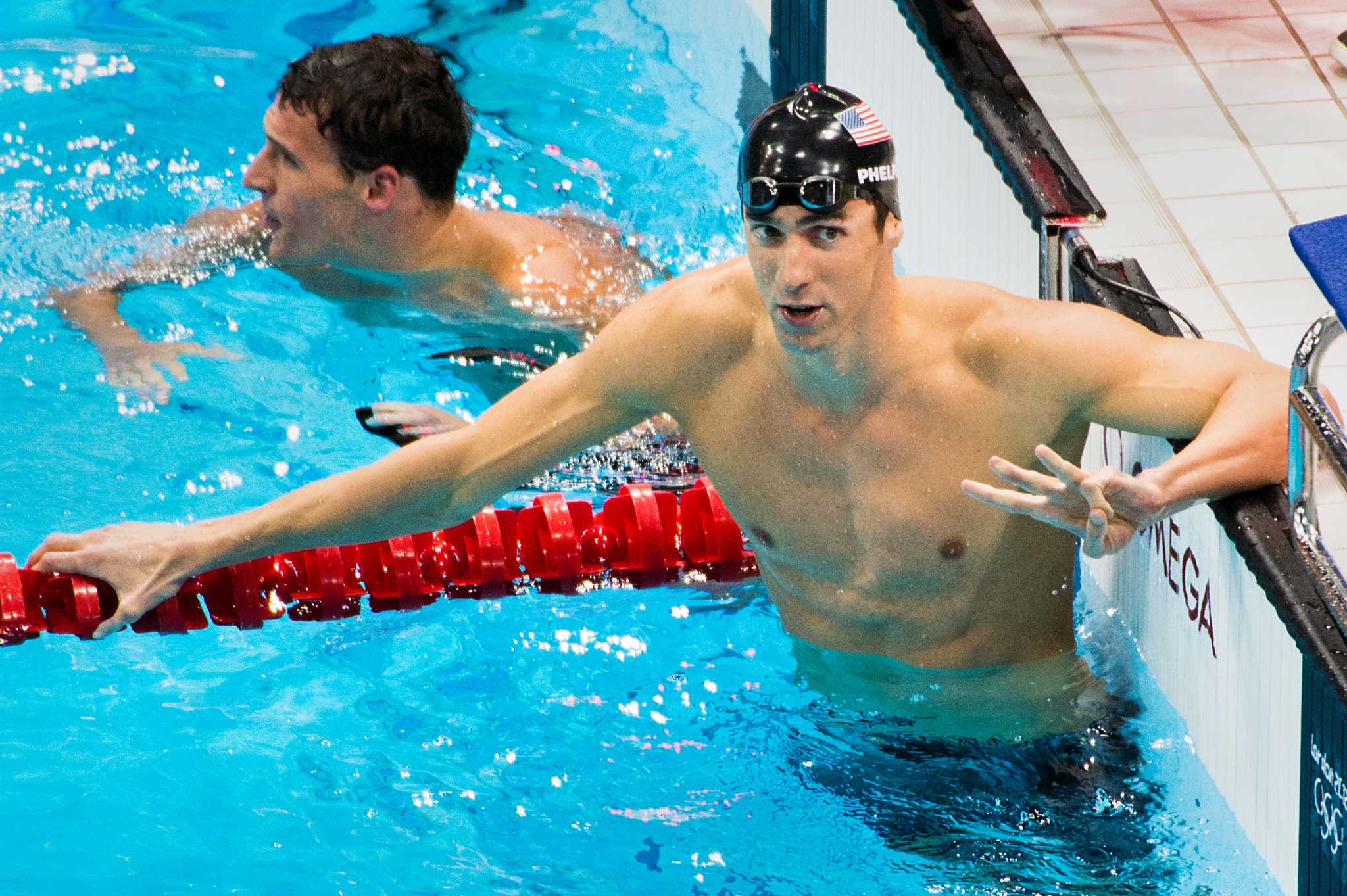 Harvey: Greatest Olympian debate extends beyond Phelps, Lewis