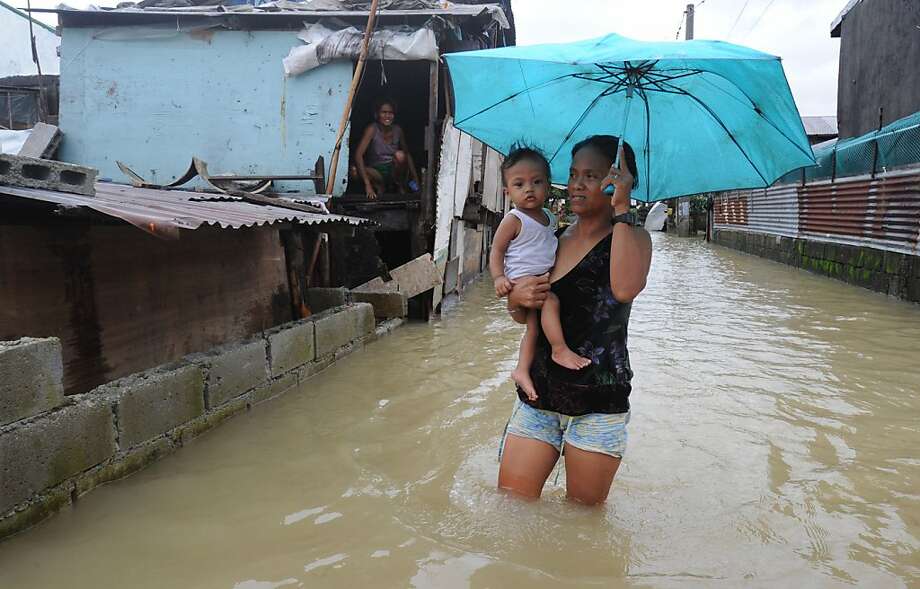 Tropical storm slams Philippines: at least 3 dead - SFGATE