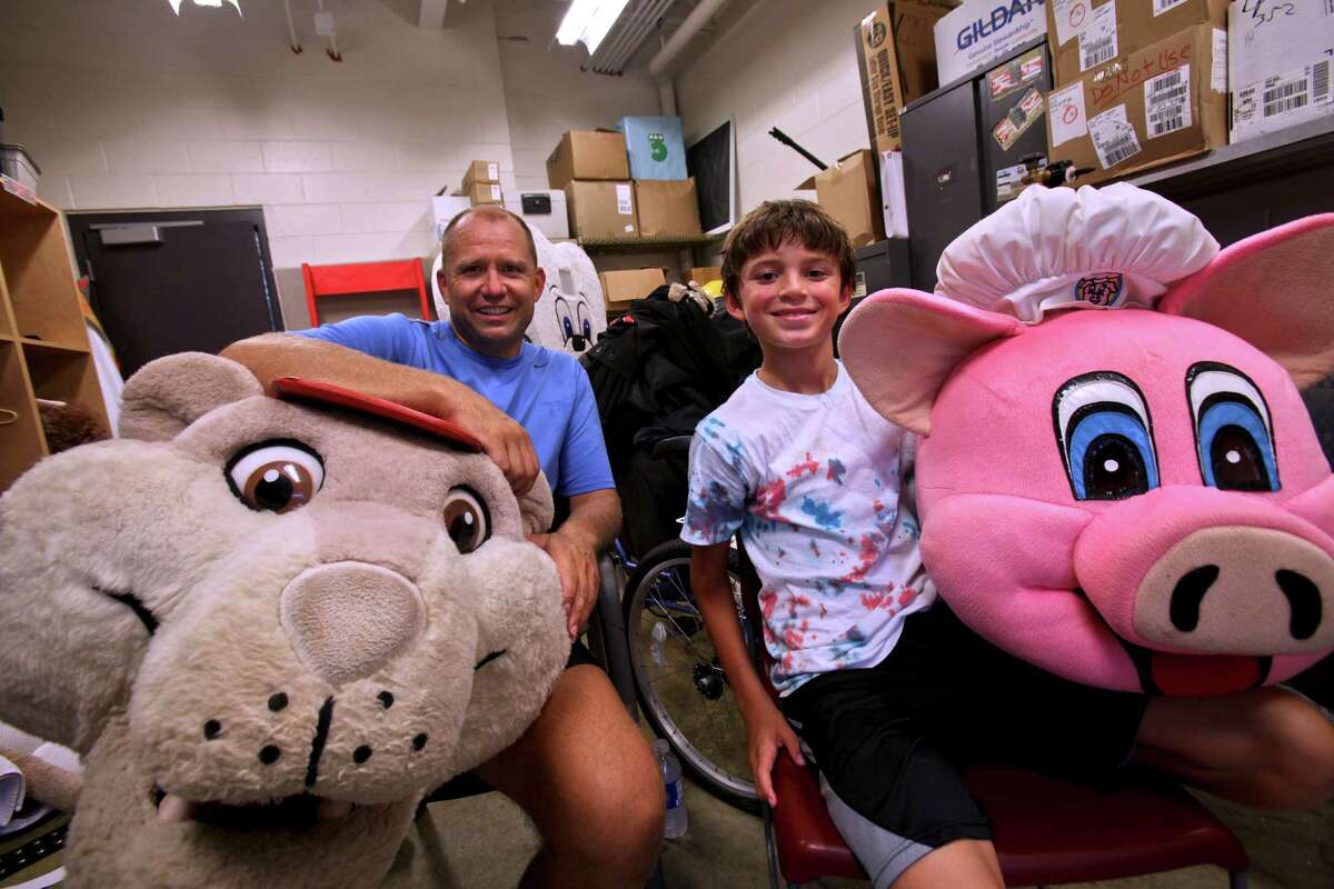 Mascot suits fit father, son