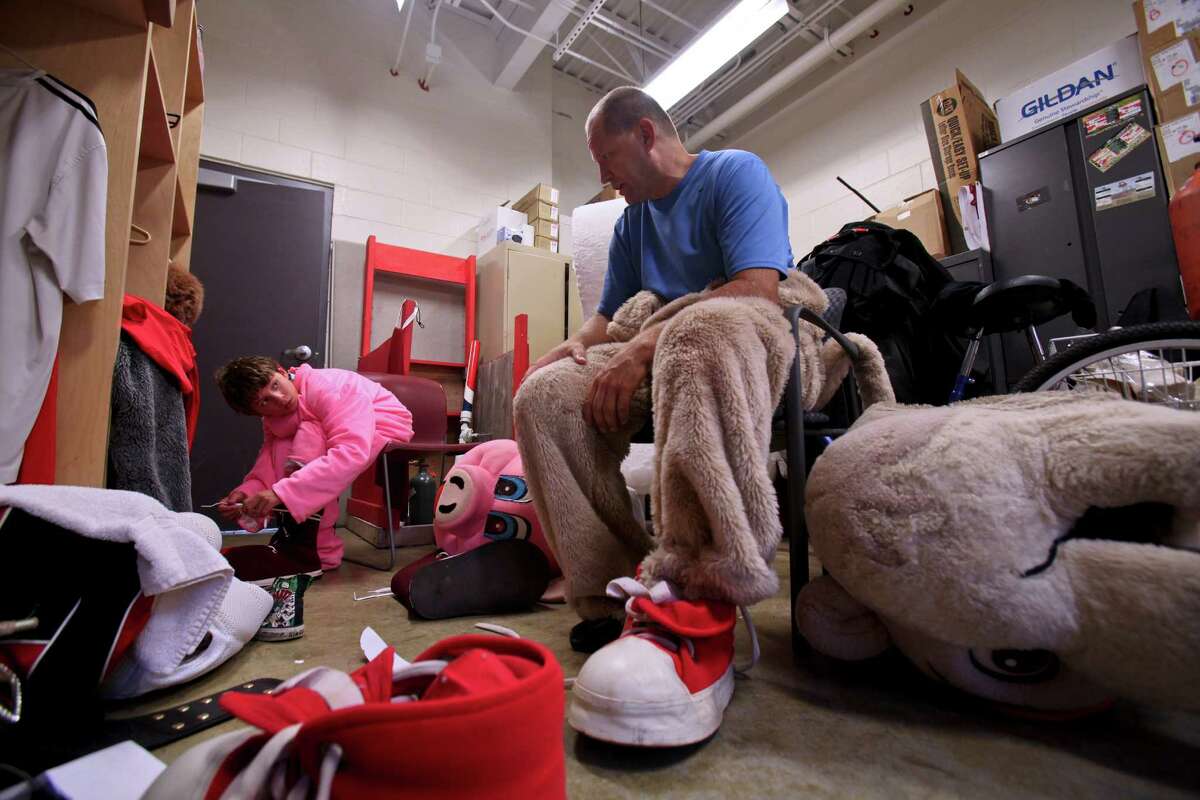 Mascot suits fit father, son