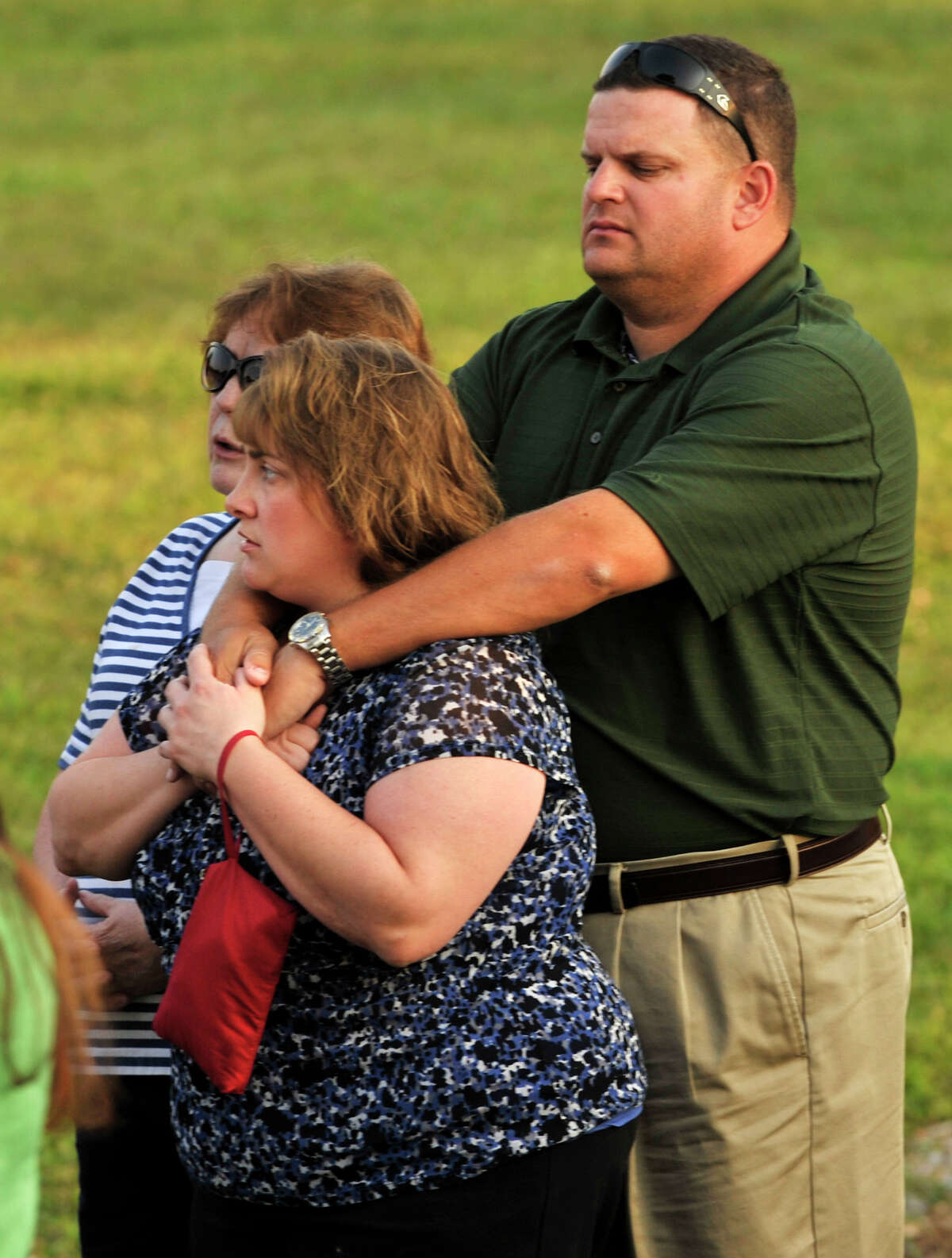 Investigators search; community gathers