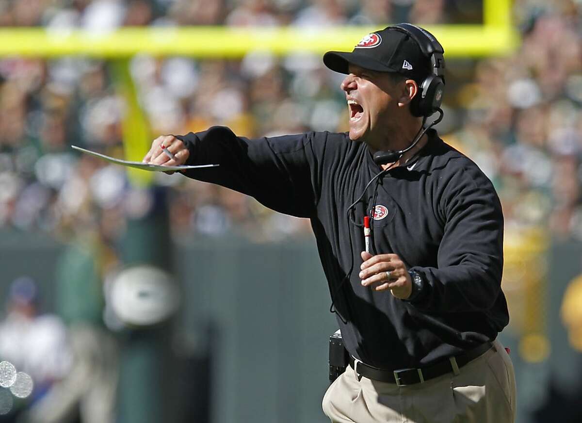 Harbaugh strongly defends Justin Smith