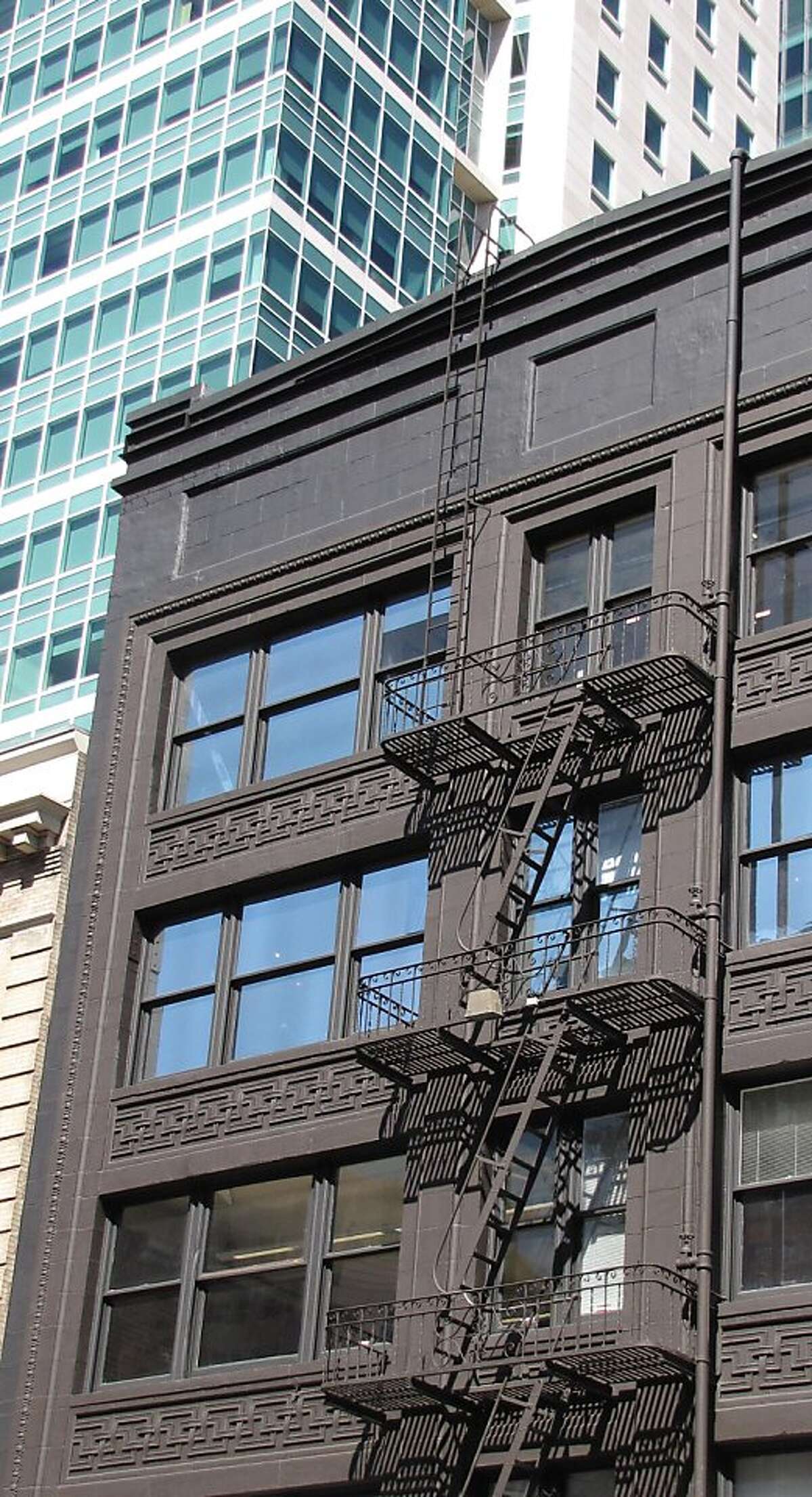 1907 building looks sharp wearing black