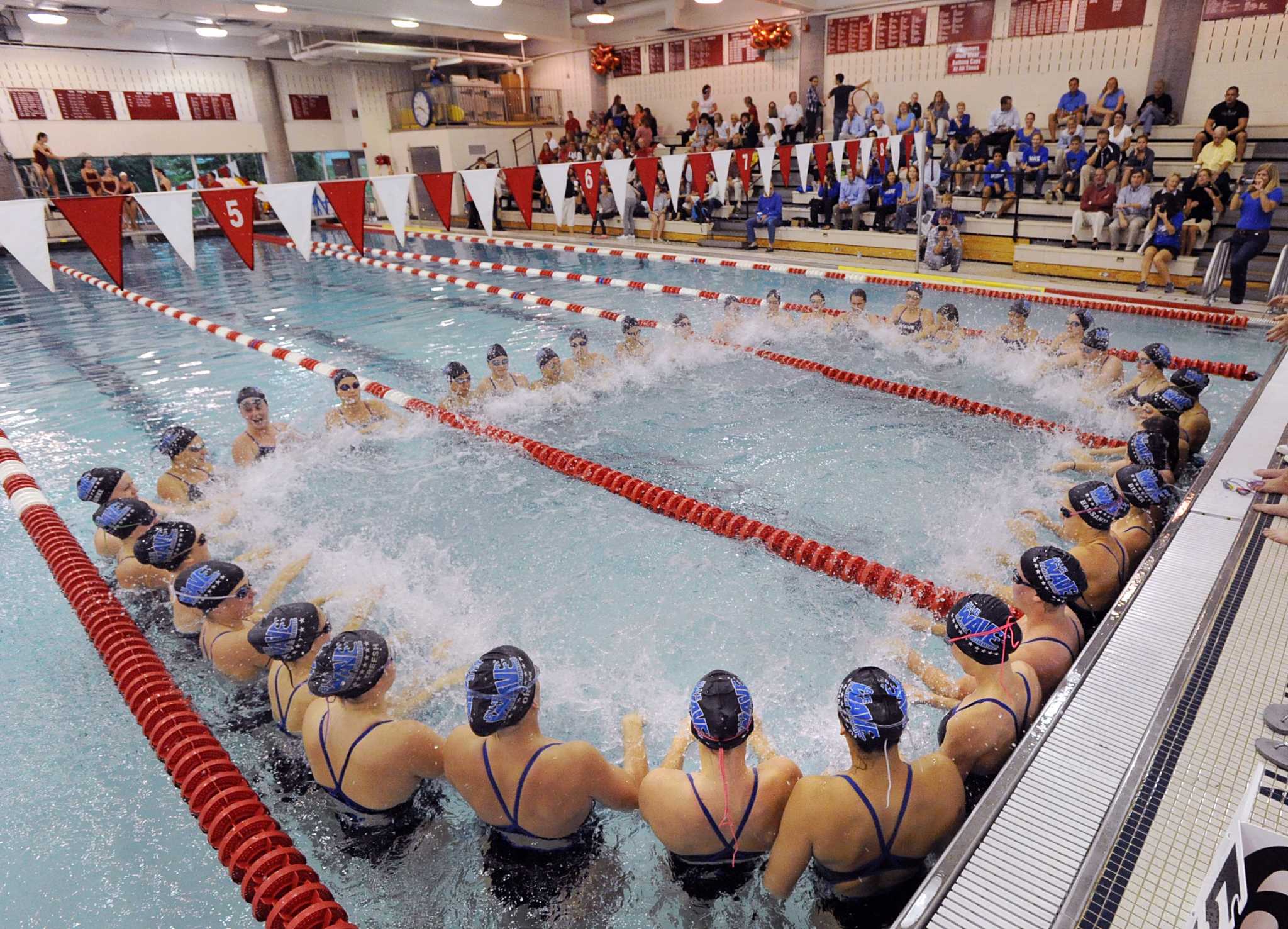 Greenwich girls swim team edges rival Darien