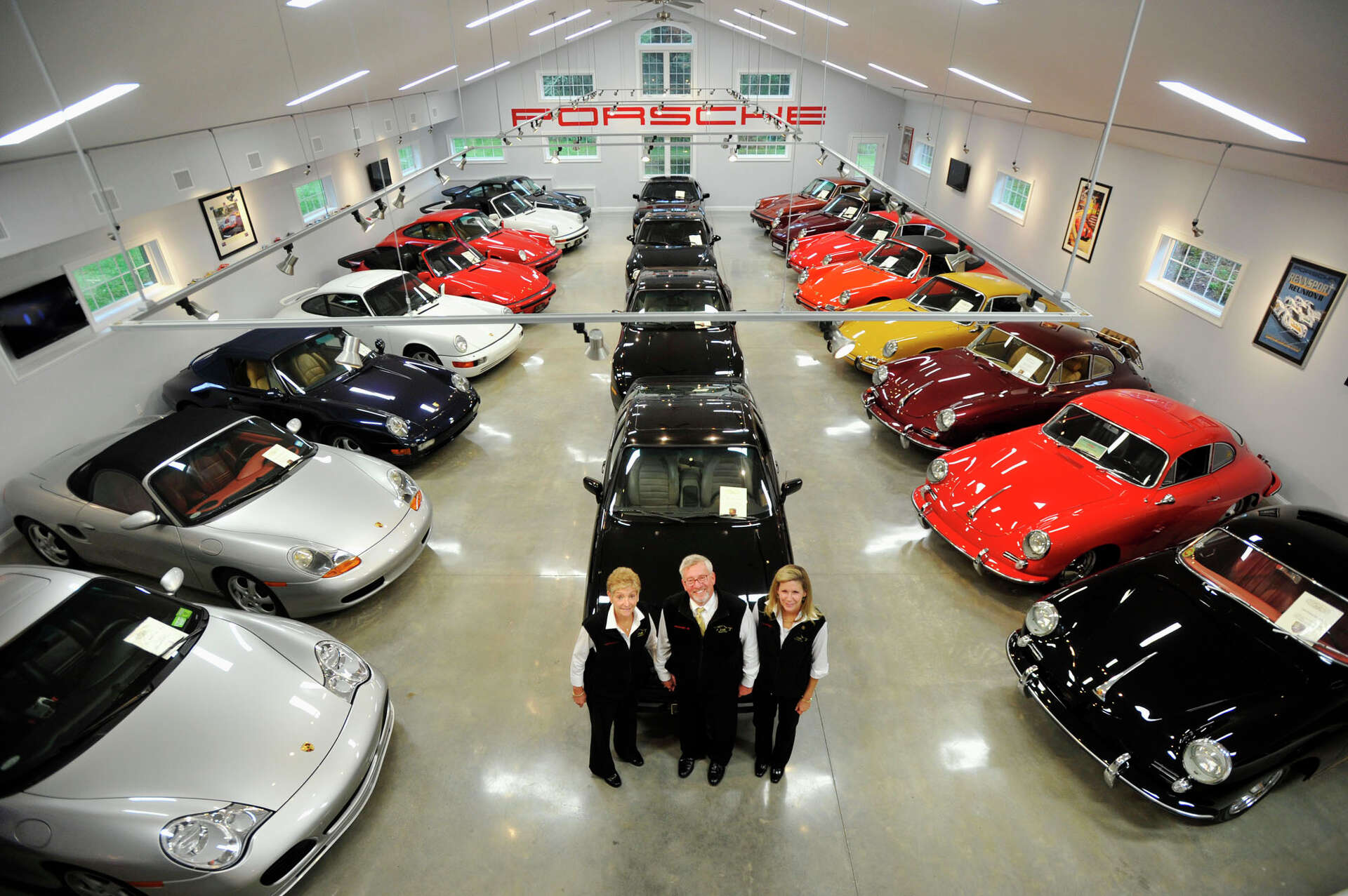 This couple likes to collect Porsches