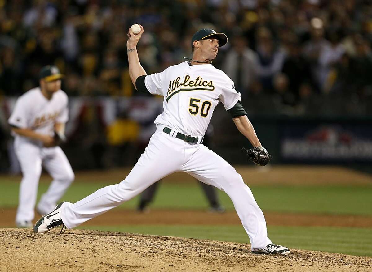 A's shut out Tigers 2-0 to stay alive