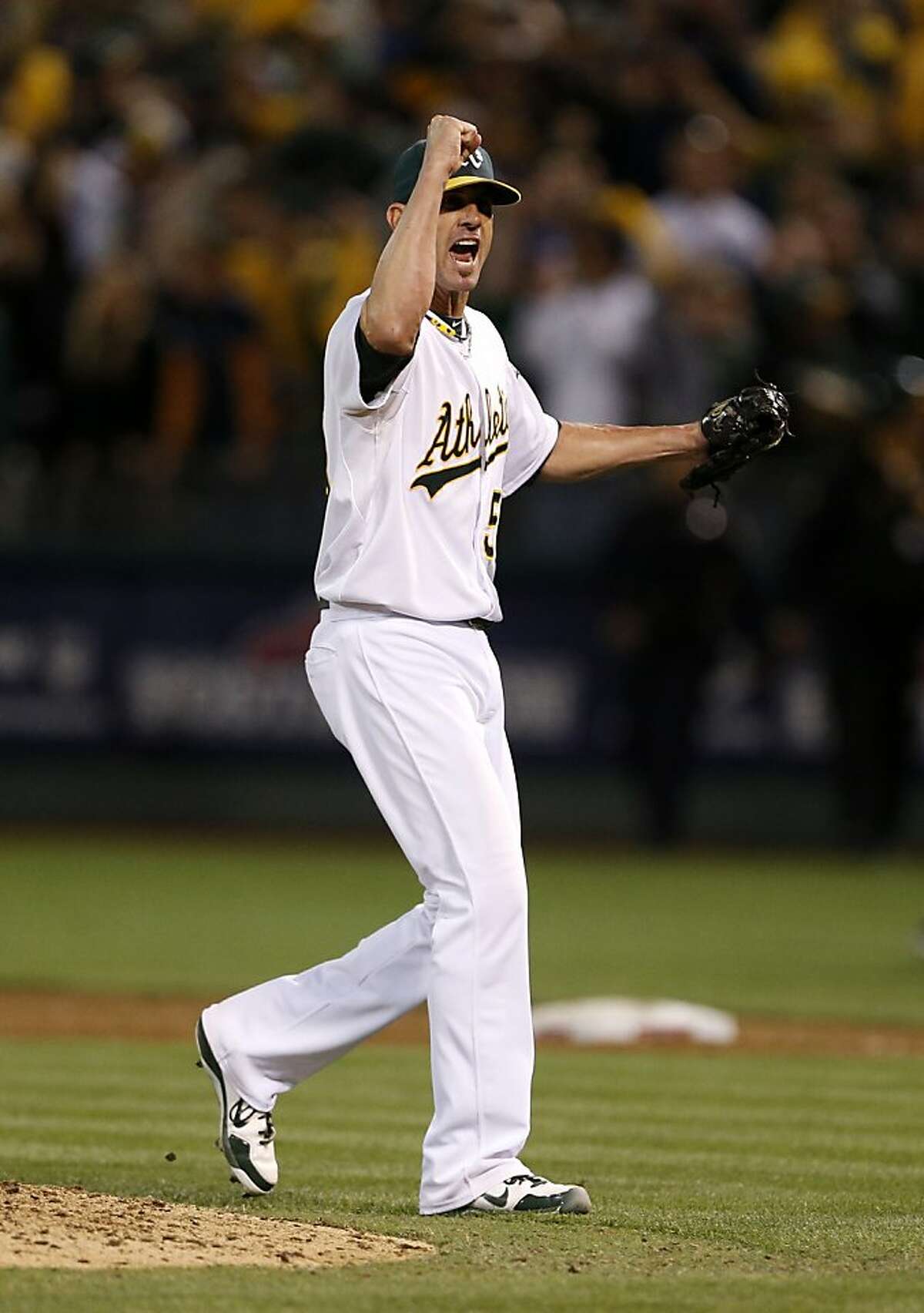 A's shut out Tigers 2-0 to stay alive