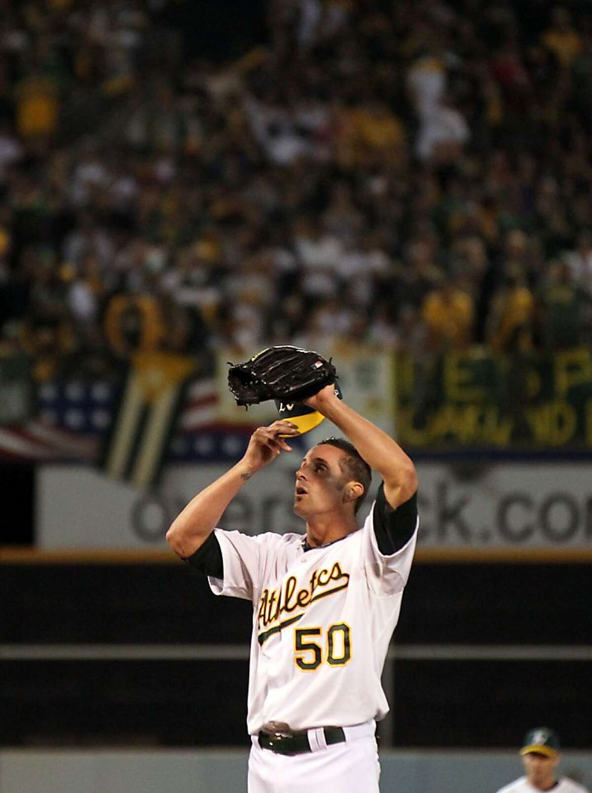 A's shut out Tigers 2-0 to stay alive