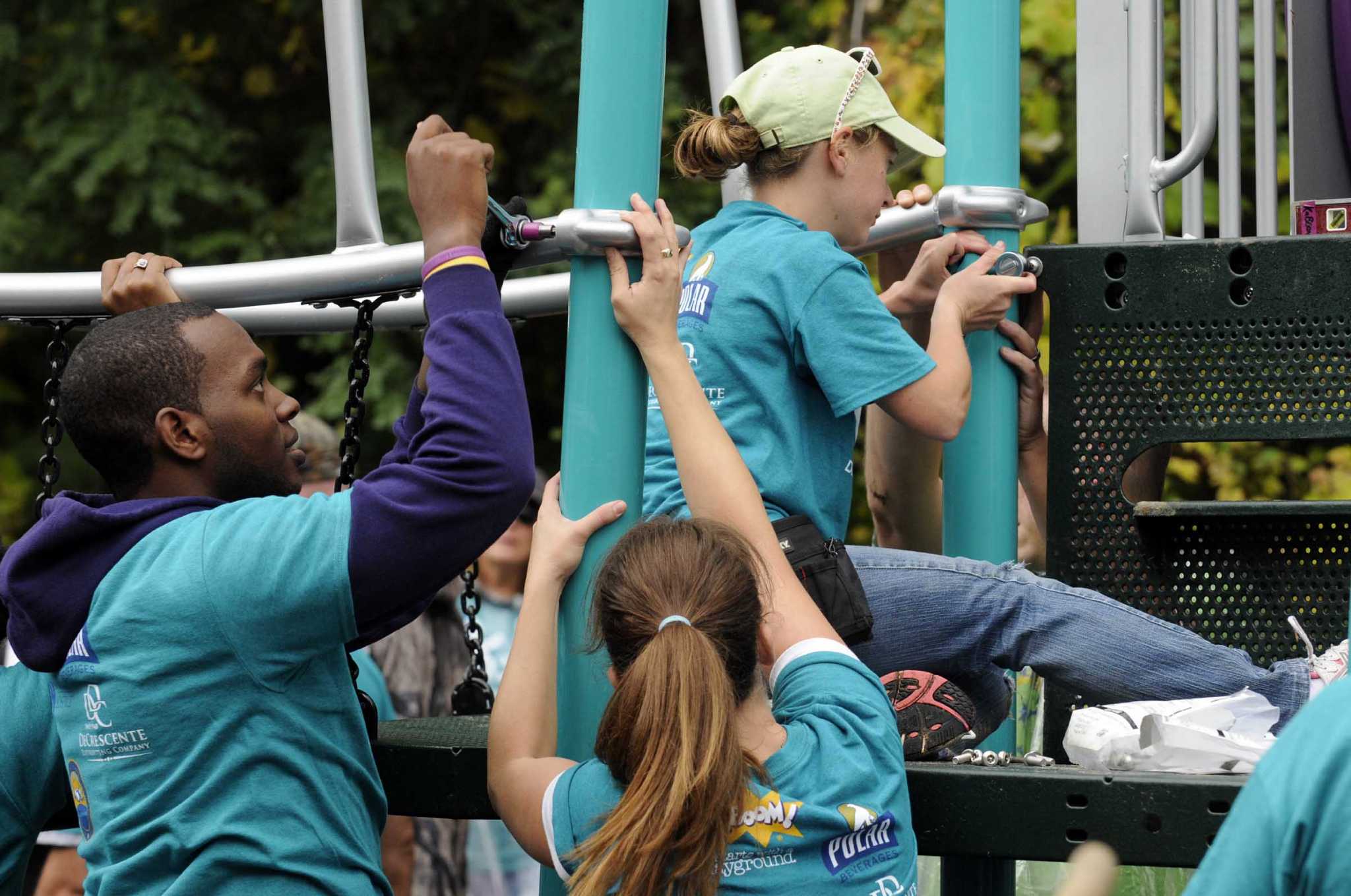 Volunteers build playground