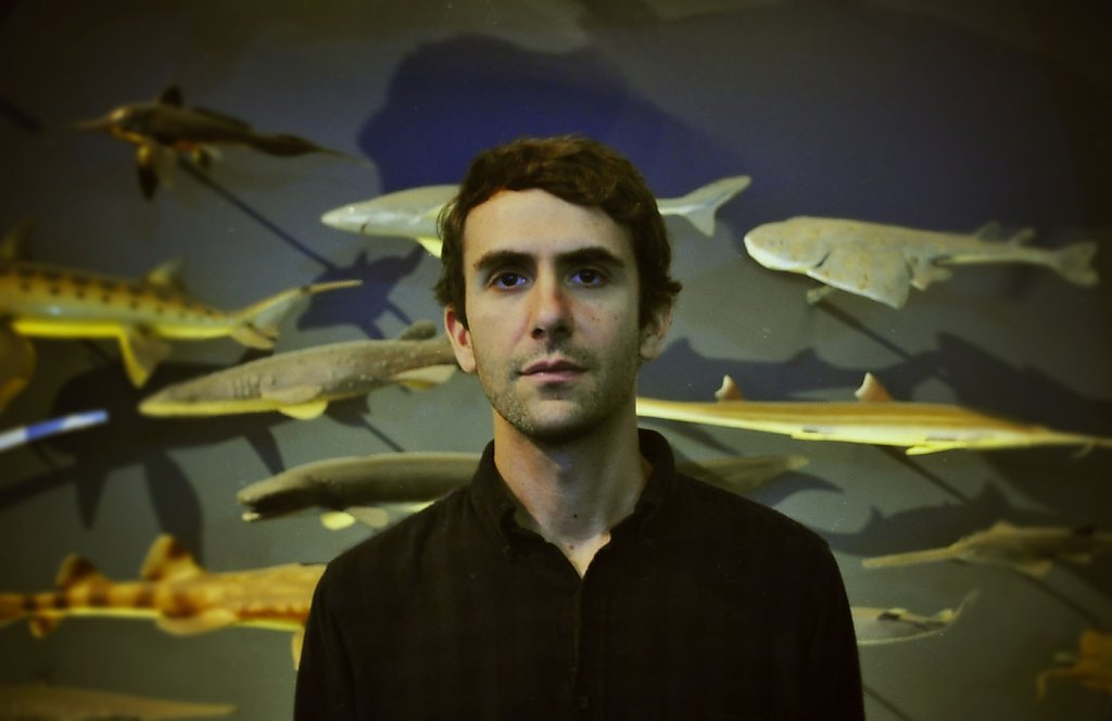 Nathaniel Parsons carves an art message