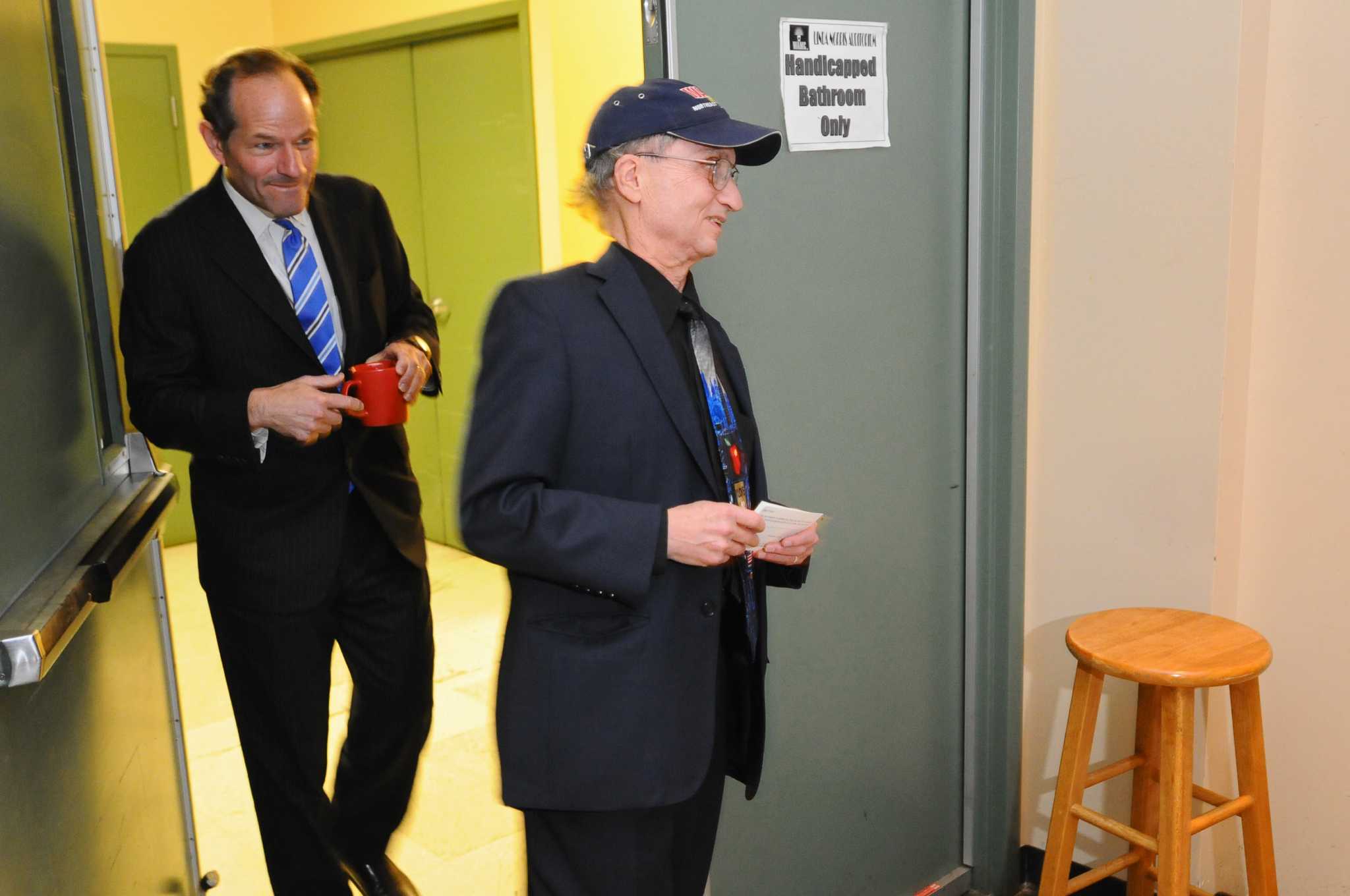 Spitzer tones it down in return to Albany