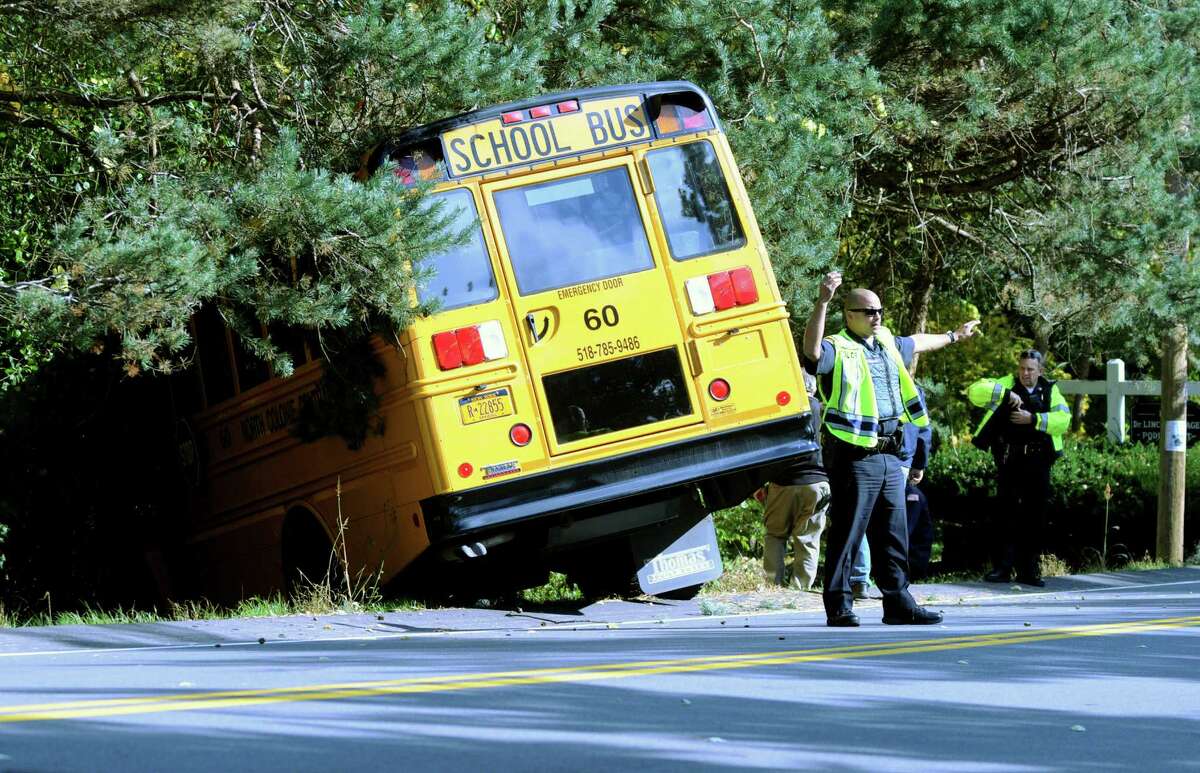 School bus slides into ditch