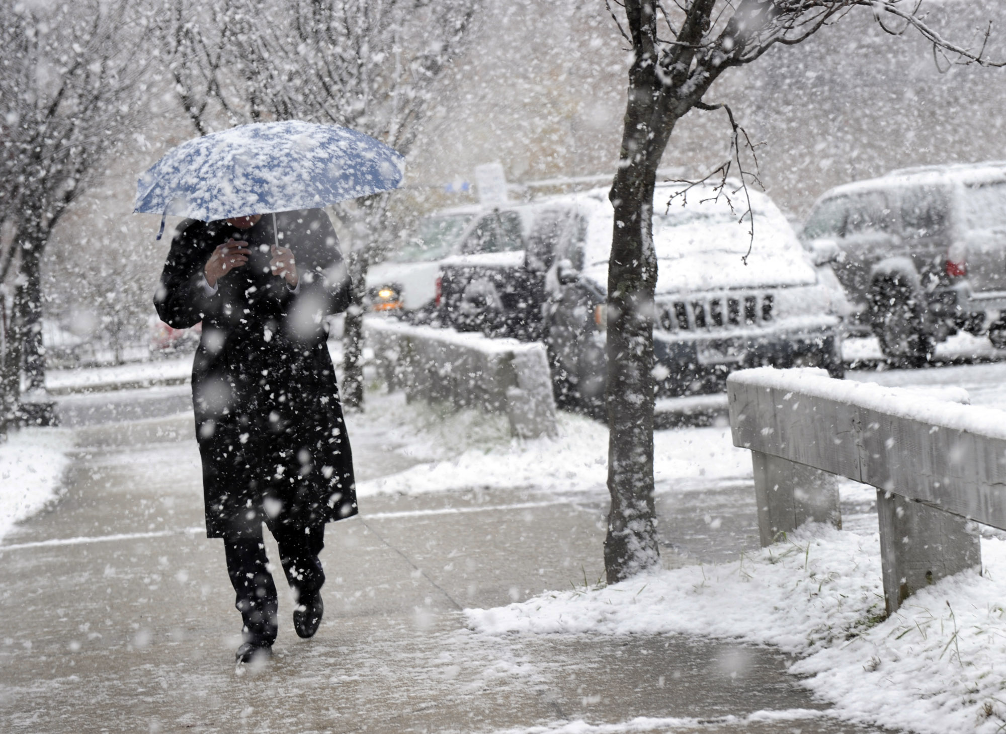 Snow continues to fall, roads remain treacherous