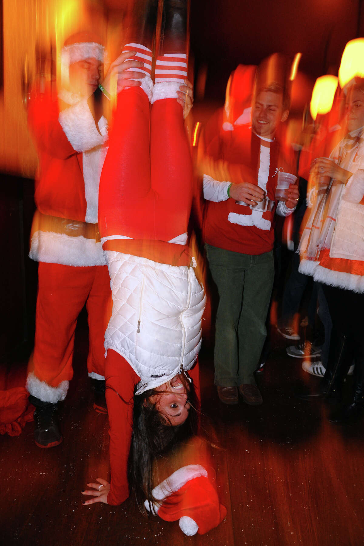 Nearly 300 Santas spread merriment in Black Rock
