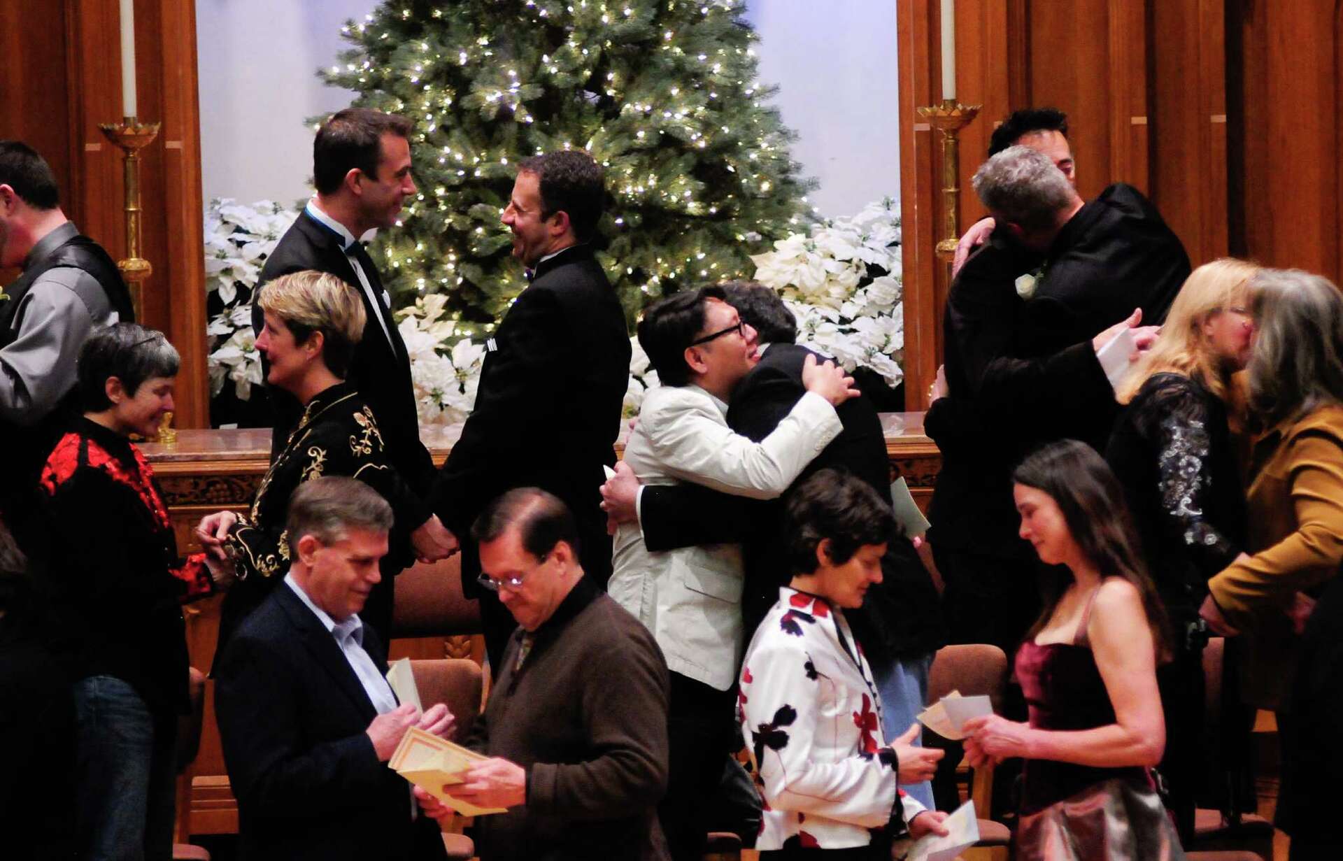 Pomp and ceremony: 25 couples marry at Seattle First Baptist