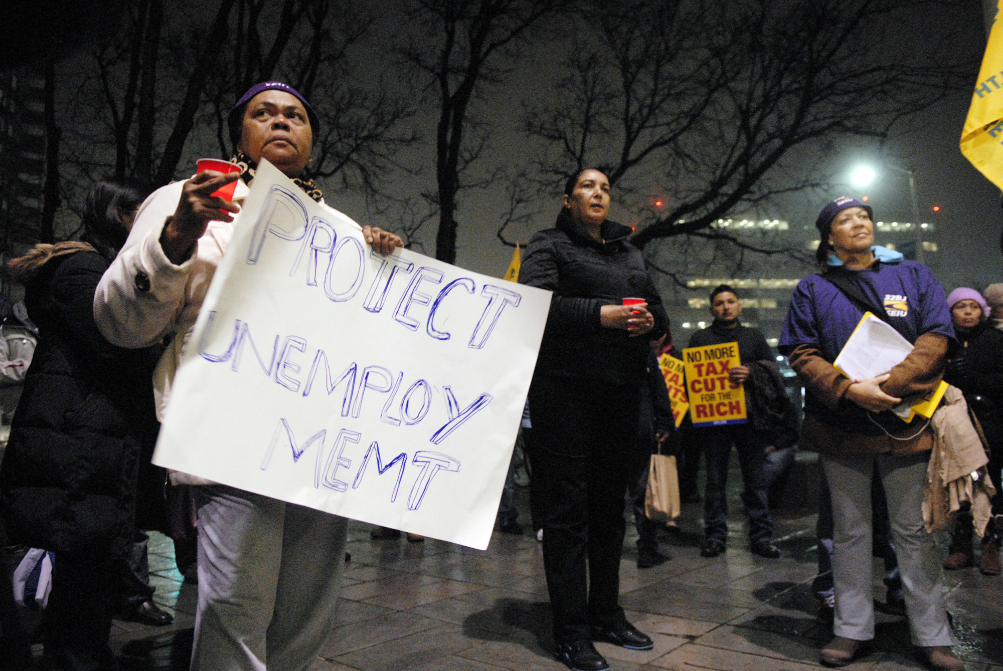 Workers protest in candlelight vigils