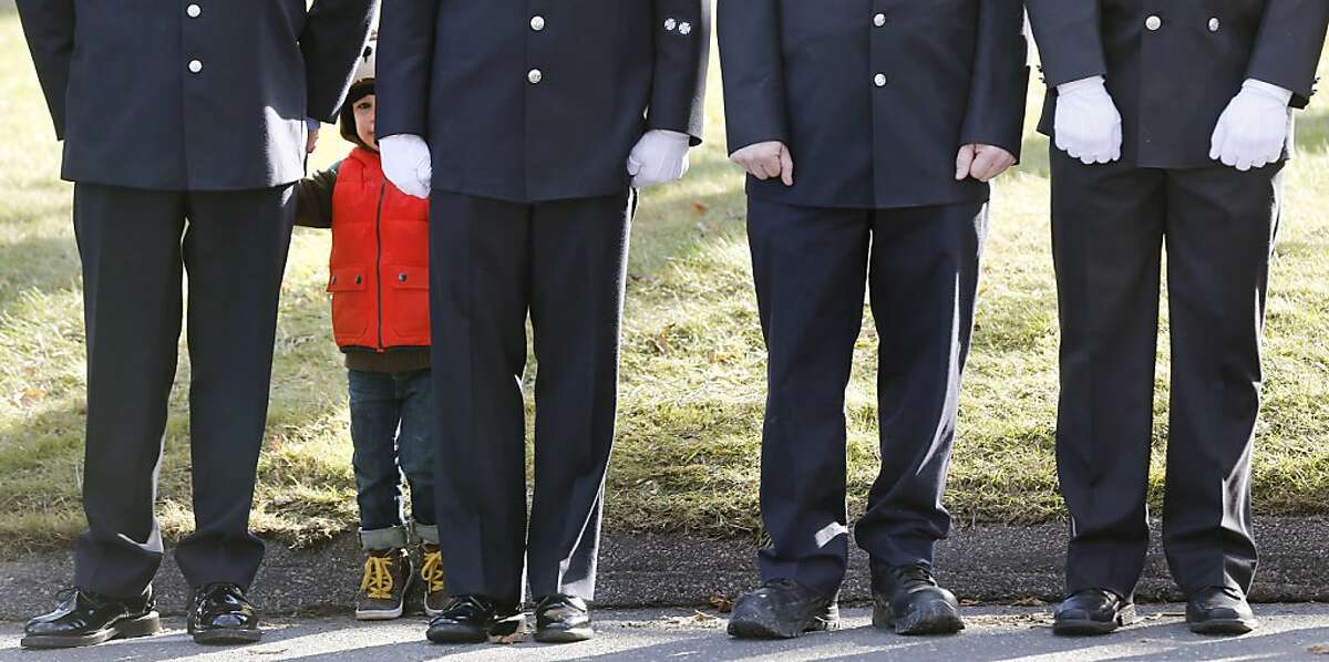 Newtown buries more shooting victims