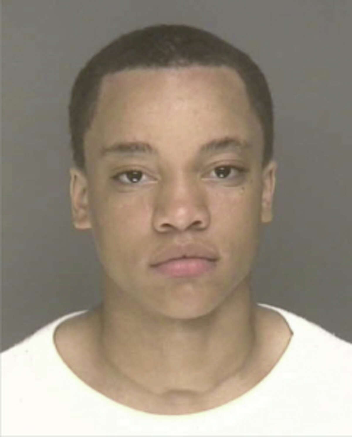 Two charged in murder that sparked curfew