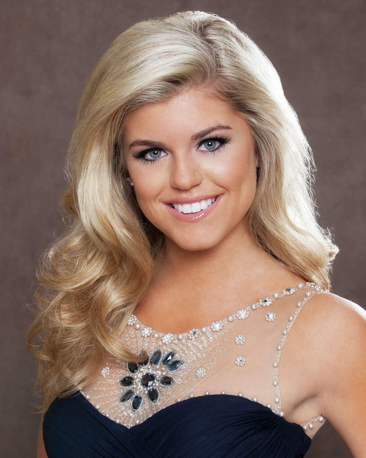 Miss Texas' first pitch off target at Rangers game