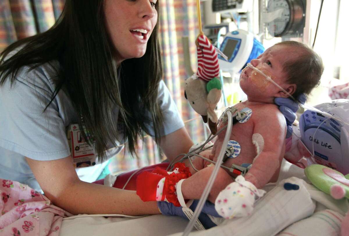 Baby born with heart outside her body goes home