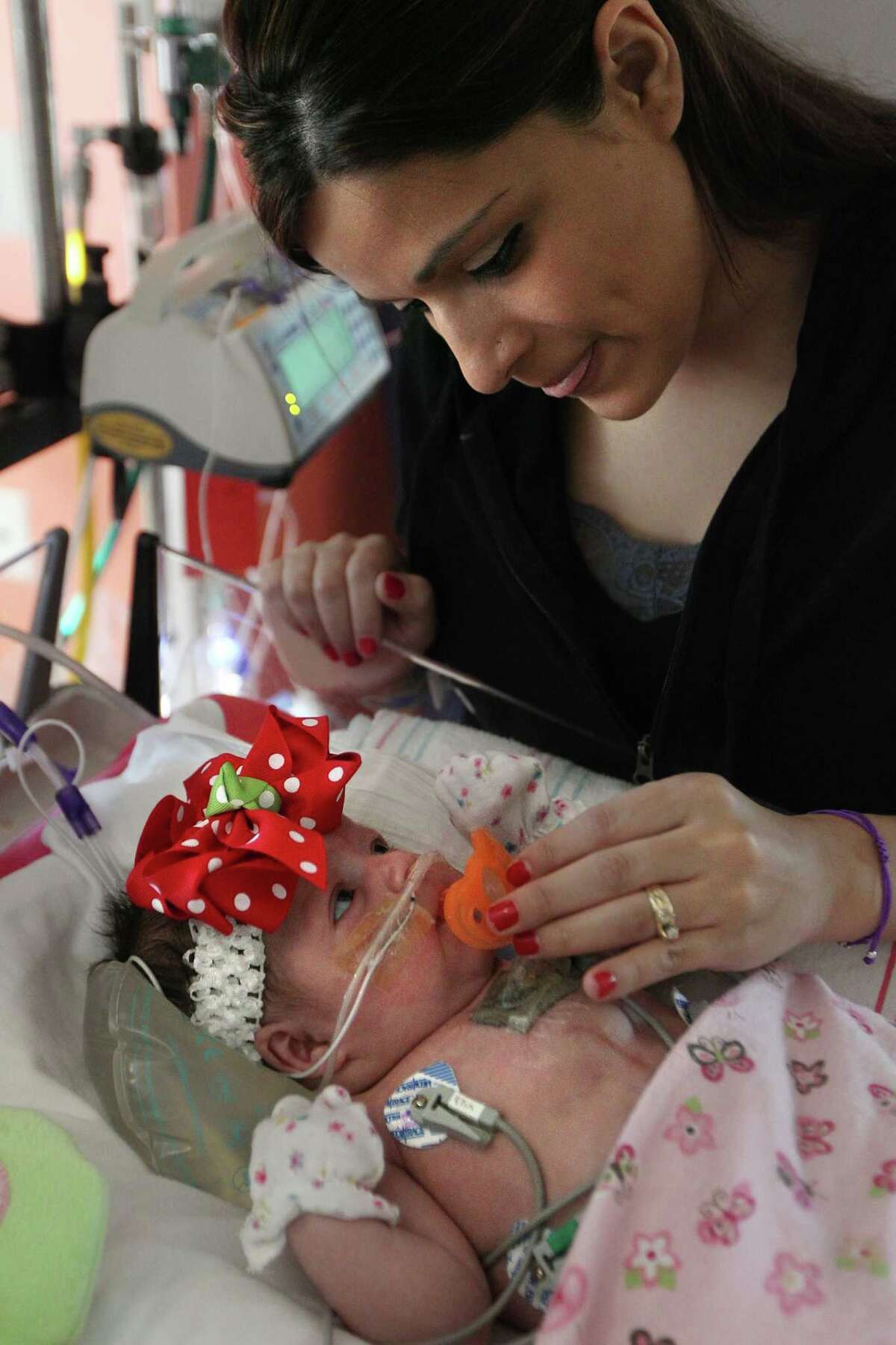 Baby born with heart outside her body goes home